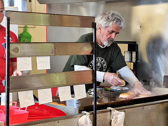 Hands that have flipped thousands of patties, creating edible memories with each perfectly timed spatula turn.