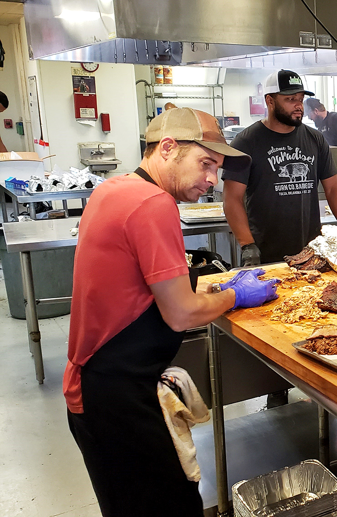 Skilled hands transforming simple ingredients into edible art. These aren't just cooks&mdash;they're meat whisperers with a higher calling.