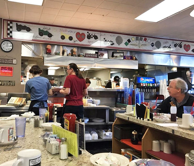 The open kitchen design lets you watch breakfast artists at work, transforming simple ingredients into plates of morning magic.