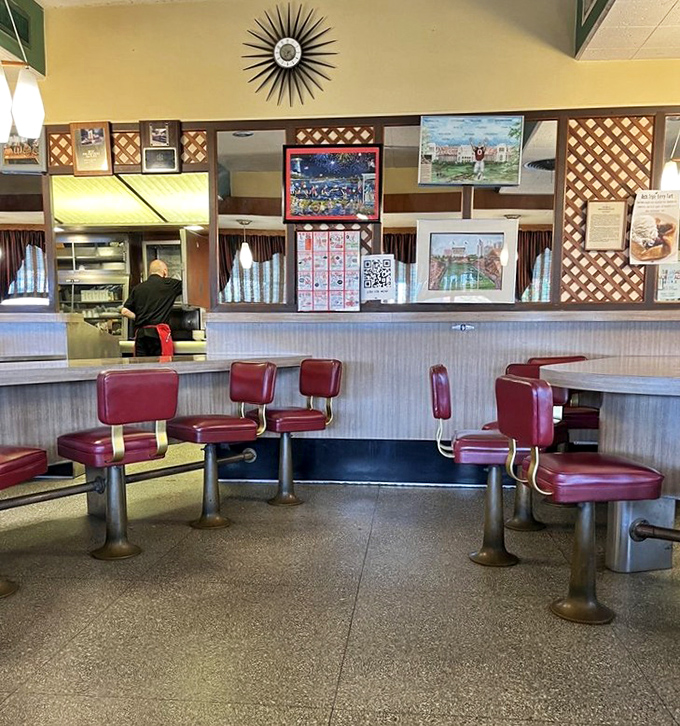 Where kitchen magic happens daily. Those red stools aren't just seating&mdash;they're front-row tickets to a performance of American diner classics.