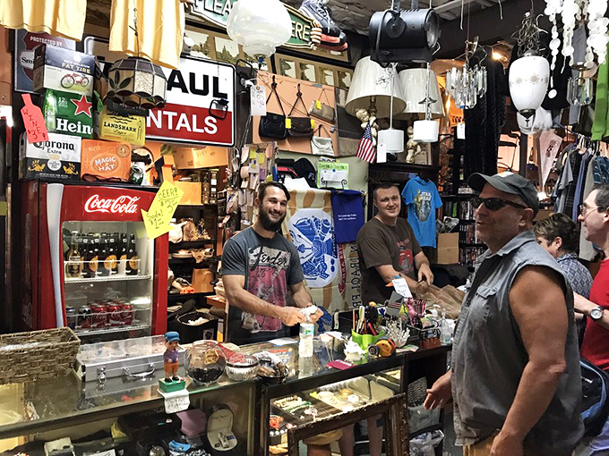 The checkout counter doubles as an impromptu community gathering spot. These folks aren't just selling vintage&mdash;they're curating memories and making connections.