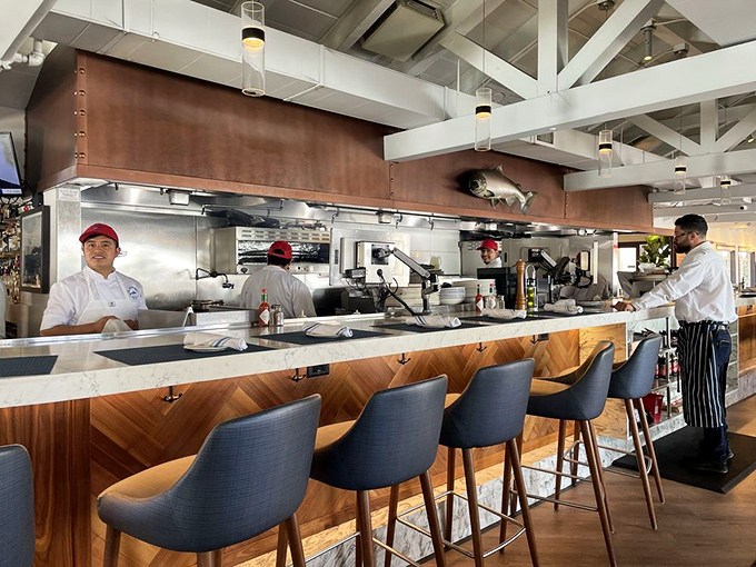 Behind the counter, culinary professionals work their magic. This open kitchen concept lets you witness the care that goes into each seafood creation.