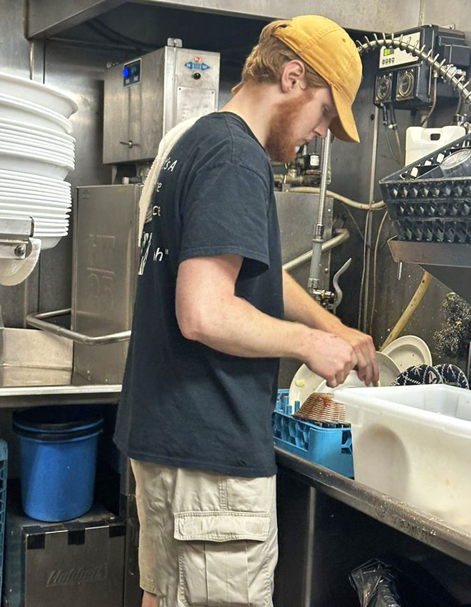 Behind every perfect plate is someone like this—working with focus and care to ensure your seafood experience is nothing short of magical.