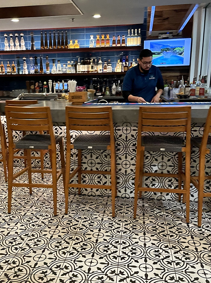 Behind the bar, skilled mixologists craft cocktails against a backdrop of premium tequilas, turning ordinary happy hours into memorable fiestas.