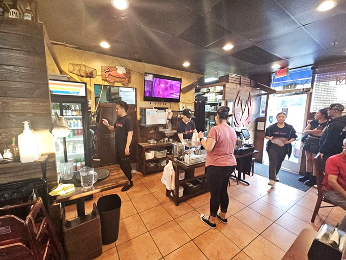 The bustling counter area where seafood dreams are assembled and delivered by staff who know their way around a crab leg.