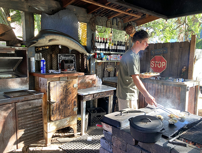 Behind every great seafood joint is someone tending the grill with the focus of a surgeon and the timing of a jazz musician.