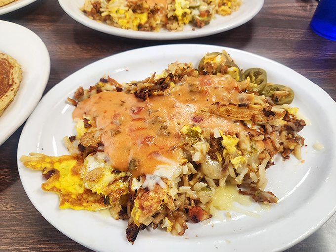 Stan's Hash isn't just breakfast&mdash;it's an architectural marvel of potatoes, eggs, and cheese that makes you wonder why you'd ever eat anything else before noon.