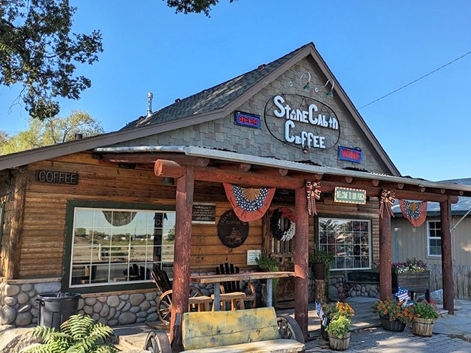 The Stone Cabin Coffee exterior promises Western authenticity without the tourist markup&mdash;a place where locals gather and visitors feel welcome.