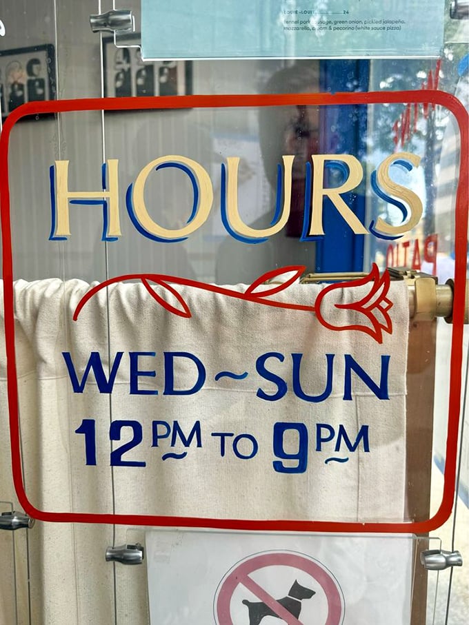 Open Wednesday through Sunday, noon to 9pm. The rose illustration is a subtle reminder of the restaurant's blooming reputation.