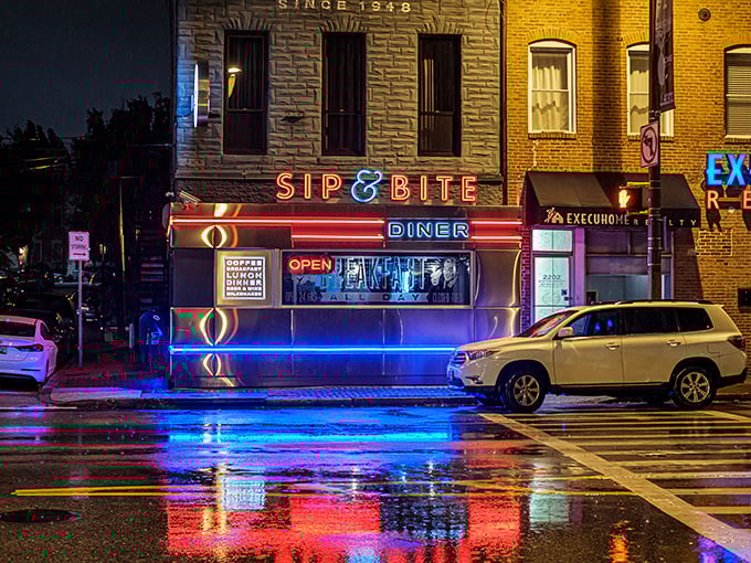 After dark, the neon glow of Sip & Bite transforms an ordinary corner into something from an Edward Hopper painting&mdash;inviting and slightly mysterious.