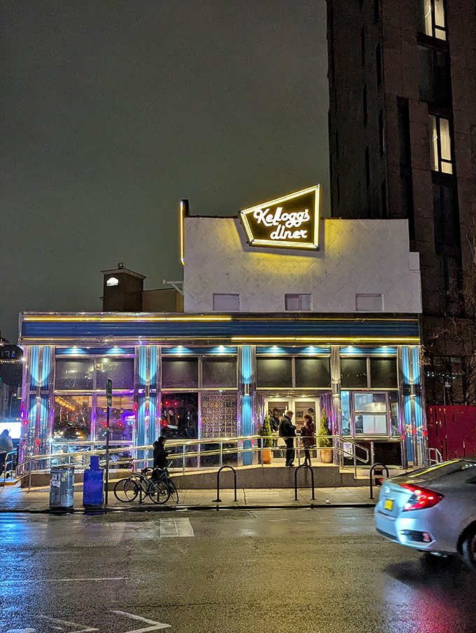 By night, Kellogg's neon glow transforms into a beacon for the hungry, the sleepless, and everyone in between. Urban poetry in blue and white.