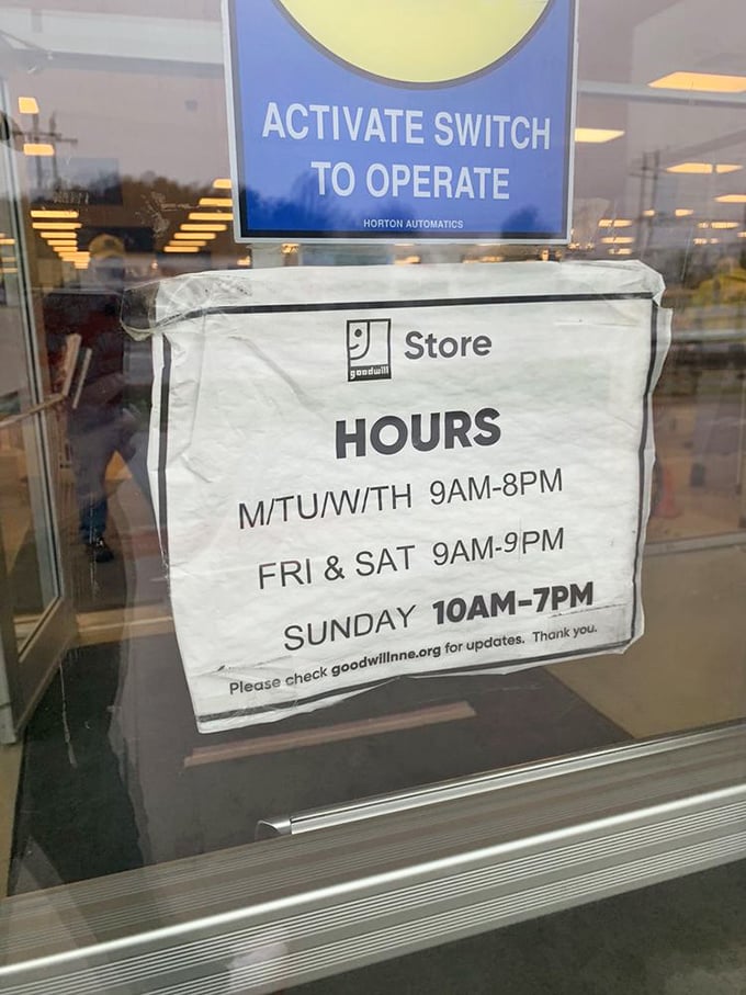 Store hours posted with the confidence of an establishment that knows you'll rearrange your schedule for a good bargain hunt.