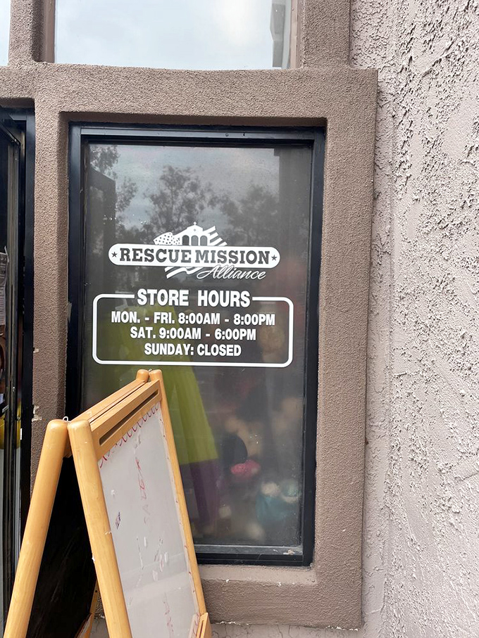 Store hours posted with no-nonsense clarity. The "Closed Sunday" is the thrift store equivalent of "Sorry, we're busy having lives too."