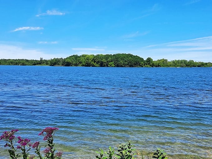 Summit Lake in all its blue glory &ndash; where the water meets the sky and your stress doesn't stand a chance.