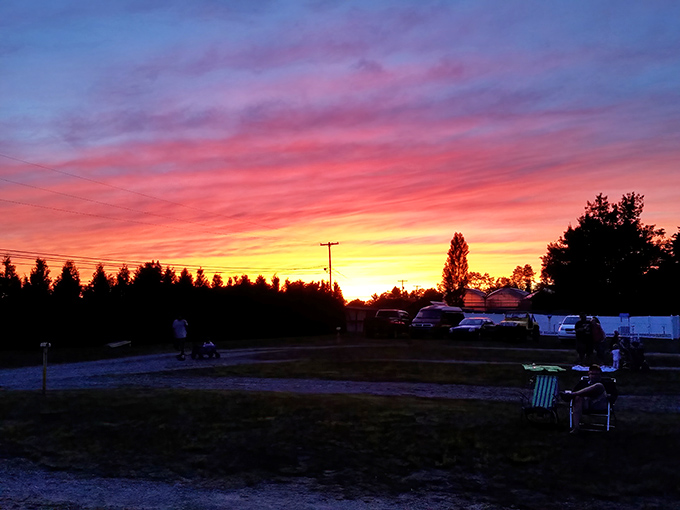 Nature provides the most spectacular pre-show entertainment: a Pennsylvania sunset painting the sky in impossible colors.
