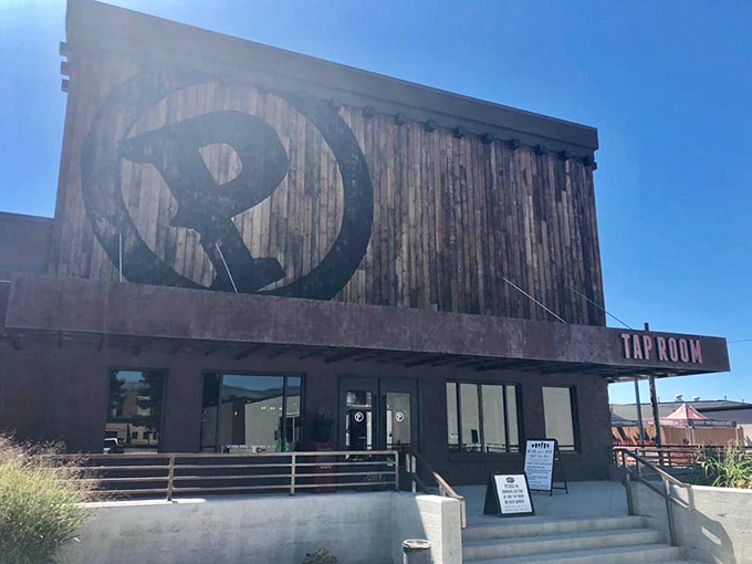 The Tap Room's rustic wooden exterior hints at the craft beer experience waiting inside, where local brews and conversation flow with equal enthusiasm.