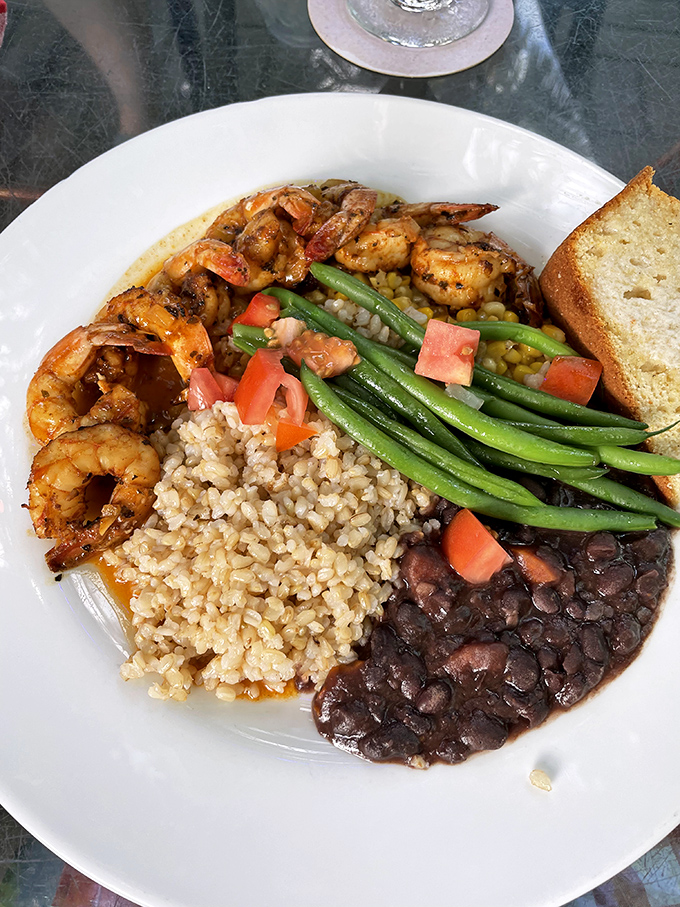Caribbean BBQ shrimp that's made friends with rice, beans, and vegetables&mdash;a plate that's basically a United Nations of flavor.