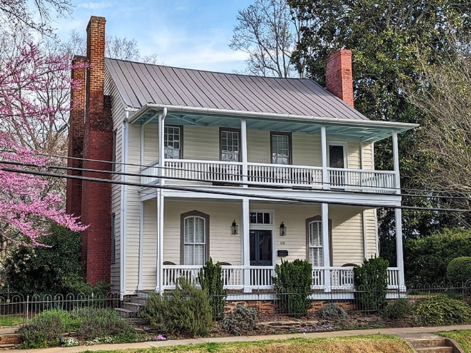This classic Southern home with its welcoming double porches practically whispers, "Come sit a spell," in the most charming accent imaginable.
