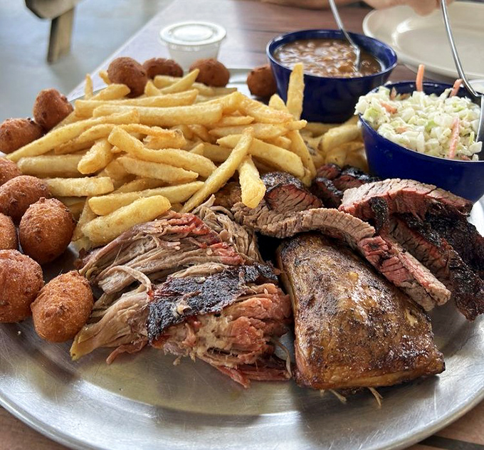 The Sampler Platter is barbecue's greatest hits album&mdash;pulled pork, brisket, chicken, golden hushpuppies, and sides that make choosing just one meat unnecessary.