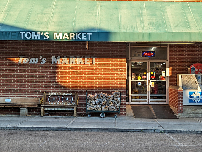 Tom's Market, where locals gather for essentials and conversation. That sunlit bench out front has probably hosted more town gossip than any therapist's couch.