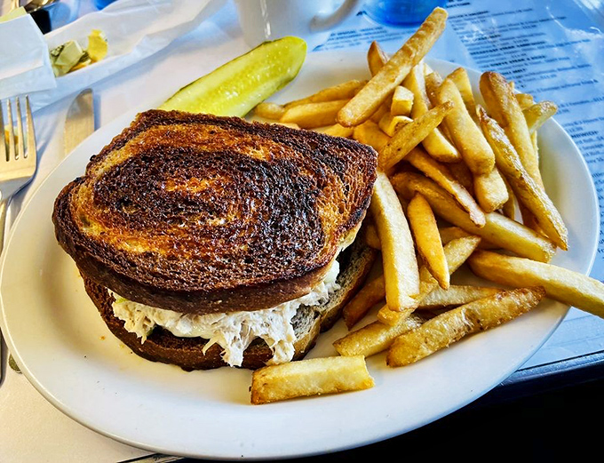 A perfectly grilled tuna melt with golden fries that proves Norm's isn't just a breakfast one-hit wonder&mdash;their lunch game deserves its own fan club.