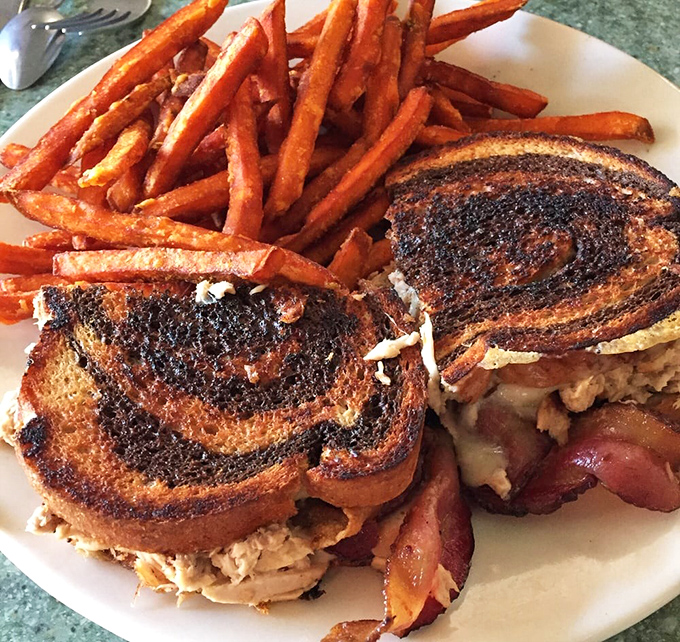 The tuna melt reimagined on marble rye with sweet potato fries standing tall. This sandwich didn't come to play&mdash;it came to satisfy.