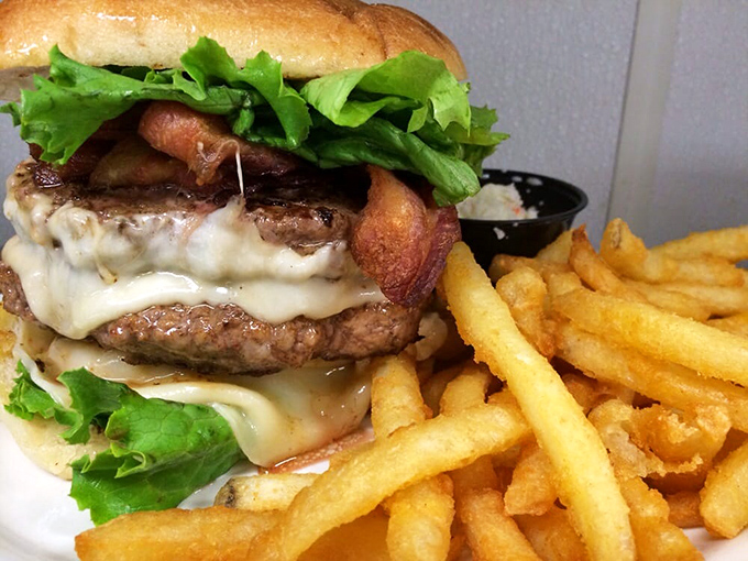 This isn't just a burger&mdash;it's a tower of power with melted cheese cascading down like a dairy waterfall. Napkins: mandatory.