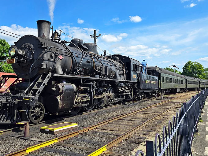 The mighty New Haven locomotive commands respect with its imposing presence. Even stationary, you can almost feel the ground rumble beneath its massive frame.
