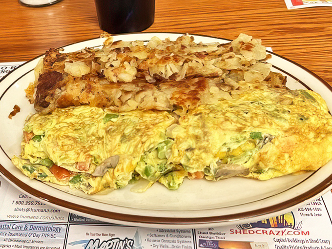 This veggie omelet and hash browns combo proves that morning excellence comes in yellow. A breakfast that says "today will be better than yesterday."