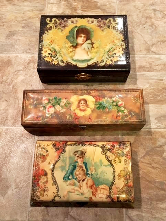 Victorian celluloid boxes that once held treasured letters and secrets now display their own artistry. The faces seem to follow you around the room.