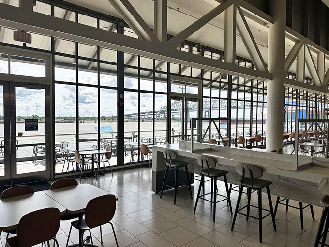 Floor-to-ceiling windows frame the mighty Mississippi, turning a simple meal break into a front-row seat to one of America's greatest rivers.