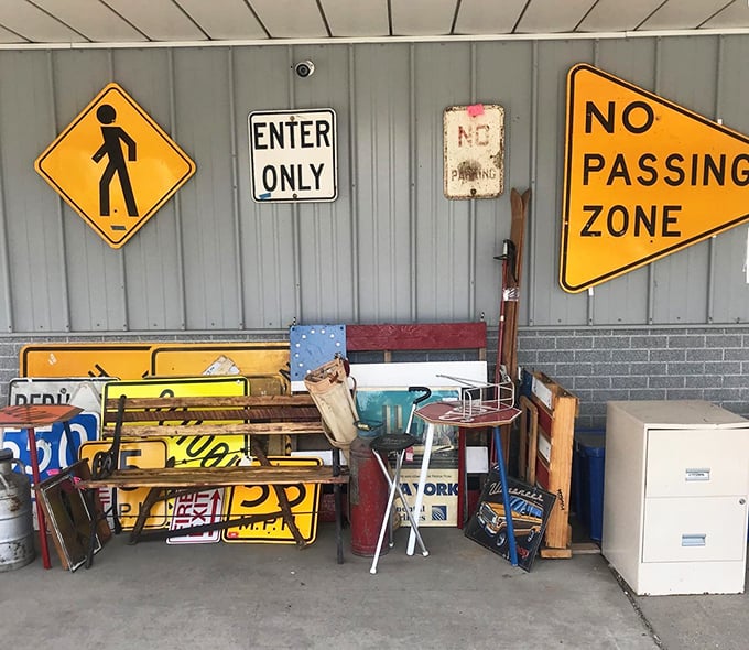Road signs that once directed traffic now direct conversations&mdash;"No Passing Zone" takes on new meaning in a collector's game room.