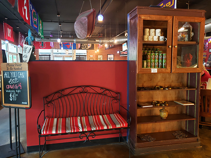 The waiting area's wrought-iron bench and rustic cabinet say, "Relax, y'all&mdash;good things come to those who wait for authentic Cajun cuisine."
