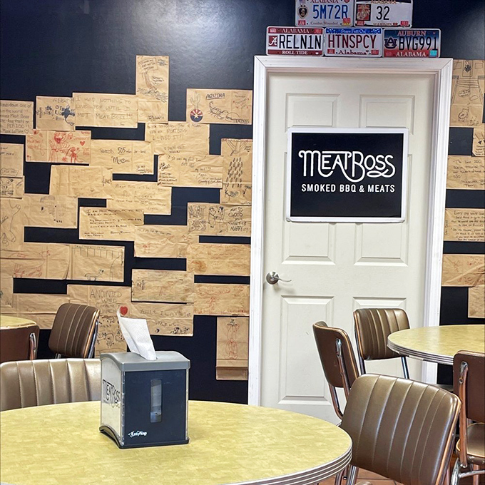 The wall of fame&mdash;customer testimonials scrawled on butcher paper create a tapestry of barbecue appreciation and devotion.