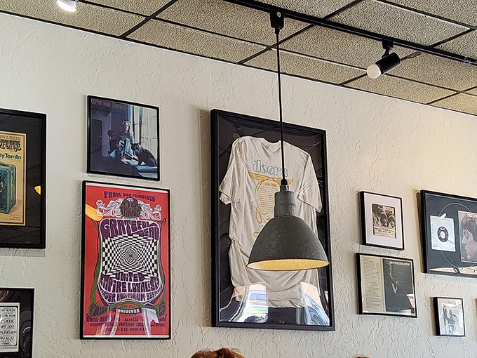 Rock posters and framed memorabilia create that perfect "been here forever" vibe. Not curated for Instagram, but accumulated through genuine history.