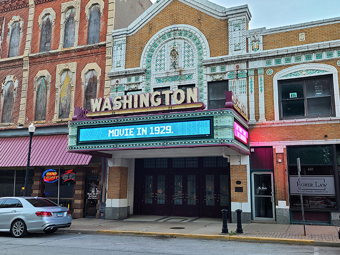 The Washington Theater's marquee glows with vintage charm, a reminder of when date night meant getting dressed up, not just putting on clean sweatpants.