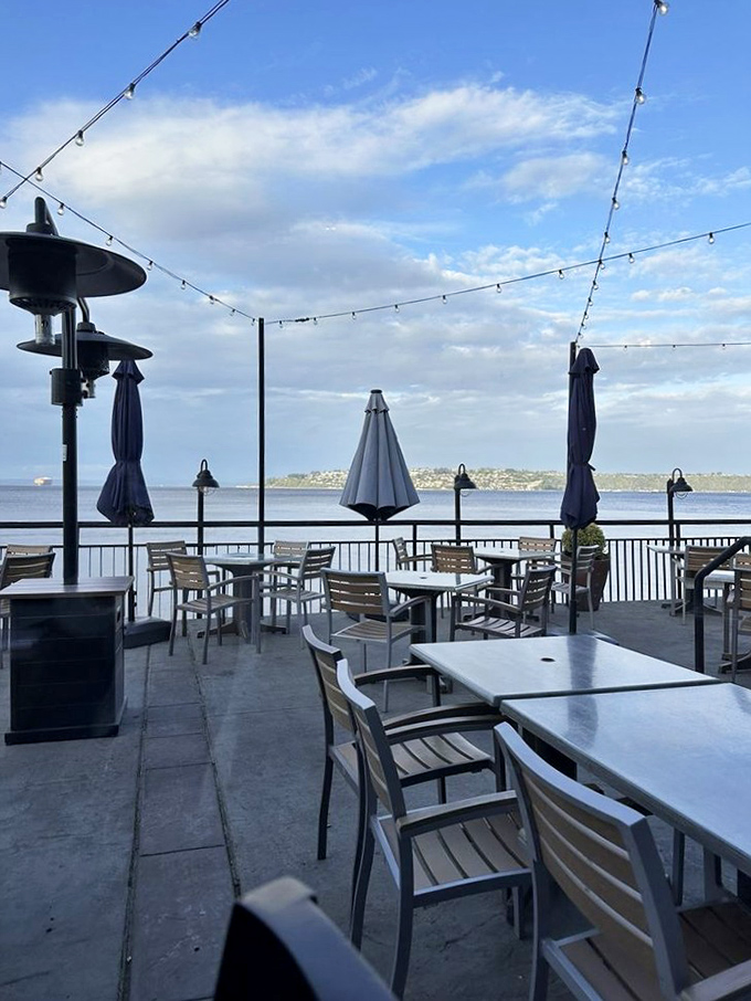 The outdoor dining deck where summer evenings stretch into twilight and seafood tastes even better with a side of sea breeze.