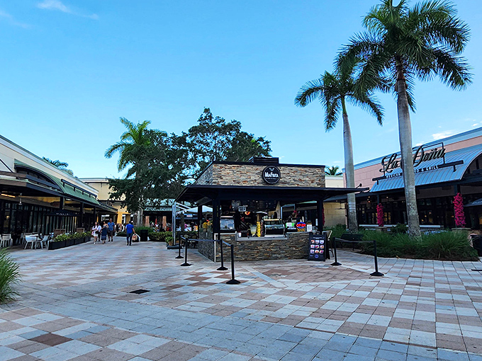 As evening approaches, the outdoor kiosks take on a golden glow, tempting even the most disciplined shoppers with one last treat.