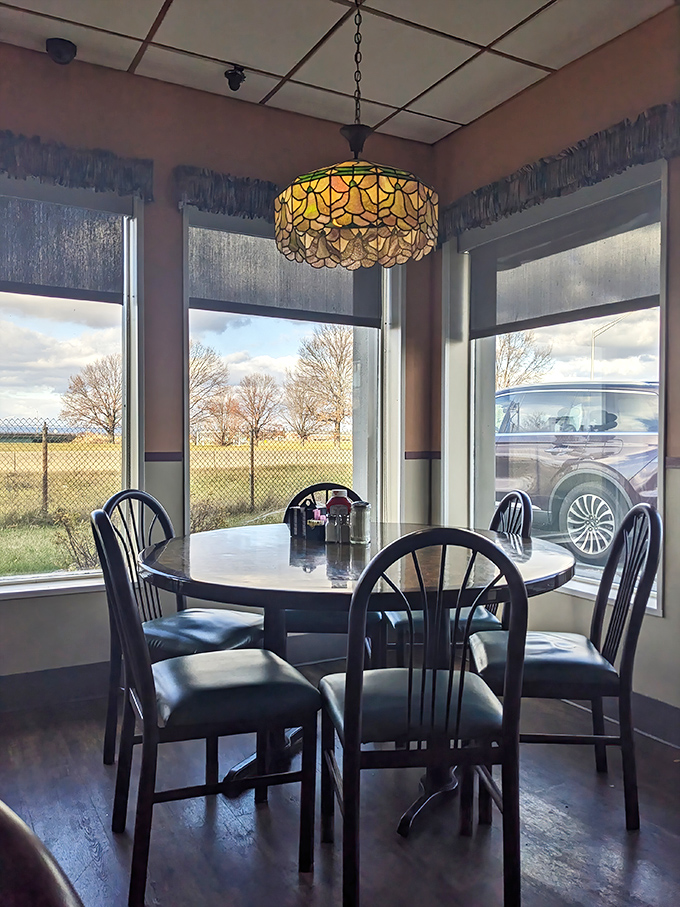 Corner booth with a view – where morning contemplation meets perfect pancake consumption in harmonious balance.