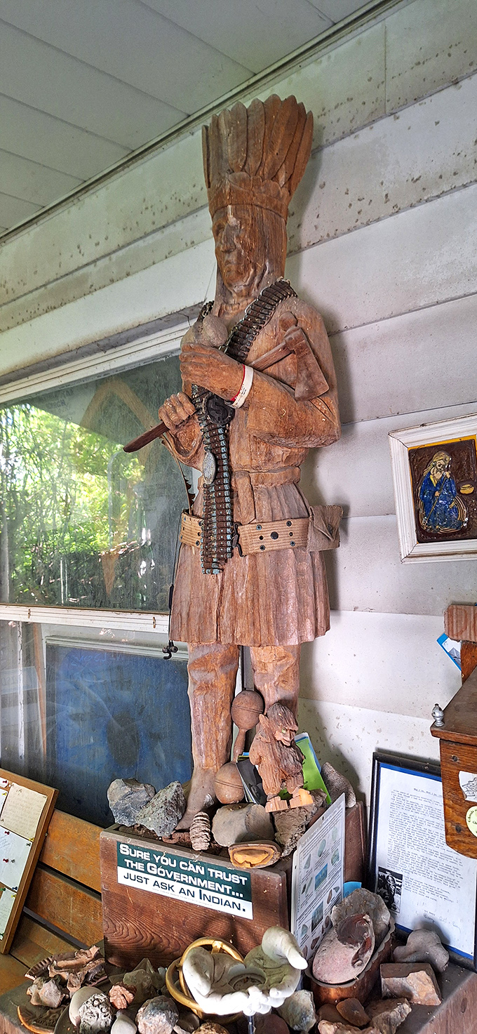 This wooden Native American carving stands as both art and commentary, with a pointed message about trust that makes you chuckle then think.