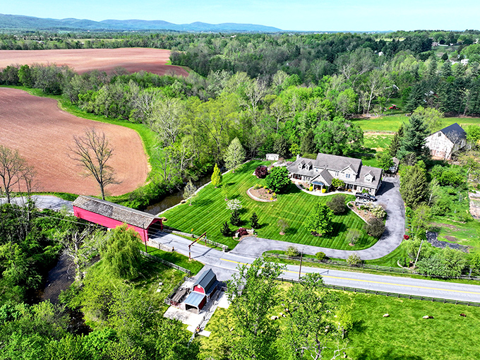 An aerial perspective reveals how perfectly the bridge fits into its surroundings—a human touch that enhances rather than intrudes upon nature.