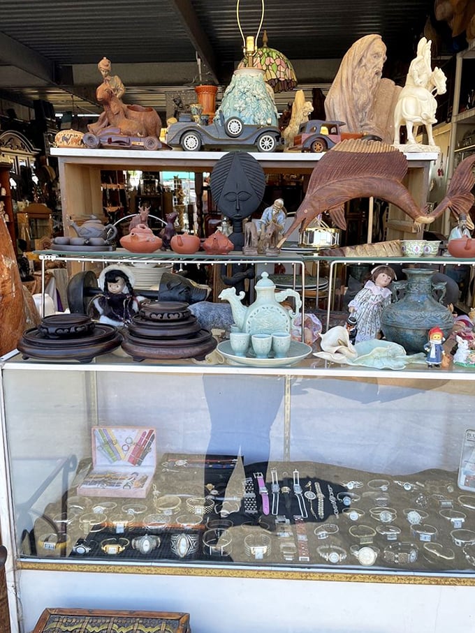 Curio cabinet dreams come true. This display of pottery, figurines and jewelry represents the "I don't need it but can't leave without it" phenomenon.