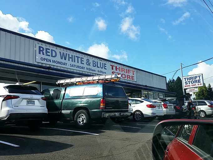 The storefront on a perfect Oregon day, when blue skies match the "Blue" in Red White & Blue. The packed parking lot speaks to its popularity.