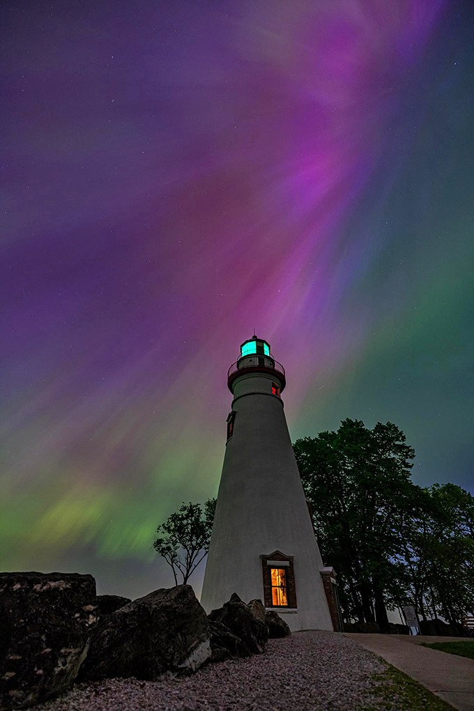 Mother Nature's light show upstages the lighthouse for once, as the Northern Lights dance across the night sky in electric technicolor.