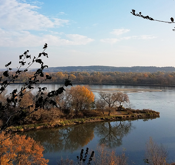Autumn paints the Platte River valley in warm hues, creating a scene so peaceful you can almost hear the leaves discussing their color choices.