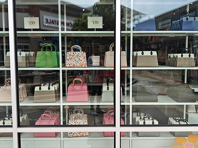 Kate Spade's handbag display window &ndash; where colorful leather dreams sit pretty at $139. Your credit card is already reaching for its wallet.