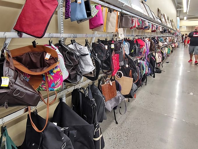 Handbag heaven where designer purses and practical totes hang in democratic harmony. That leather beauty costs less than your morning latte habit.