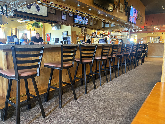 The bar at Marzoni's&mdash;where strangers become friends and friends become family over pints of house-brewed goodness.