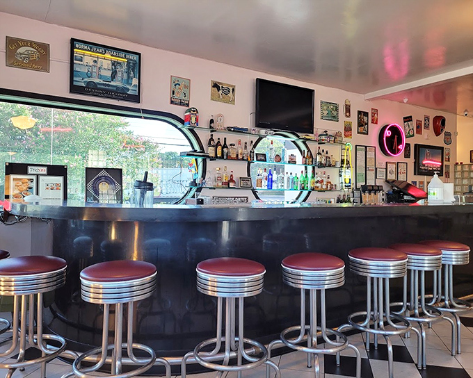 Classic diner bar stools with red vinyl seats&mdash;the perfect perch for watching kitchen magic happen up close.