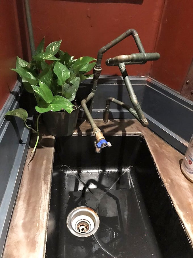 Even the bathroom sink embraces the mechanical theme. Industrial chic meets functional art in this conversation-starting washroom fixture.
